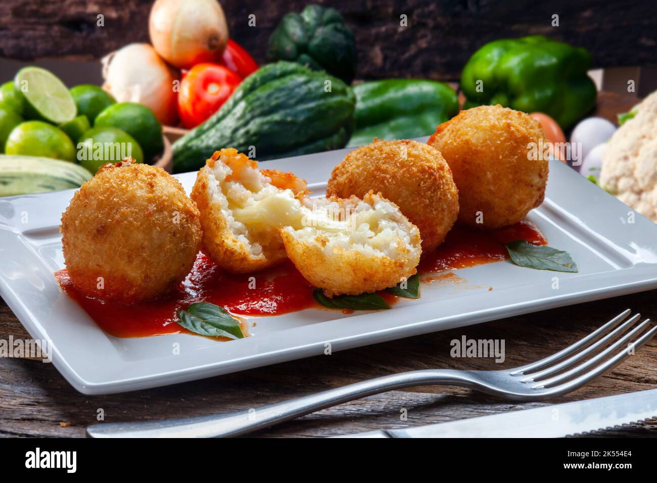 Fried rice balls. Traditional from Brazil where it is called Bolinho de ...