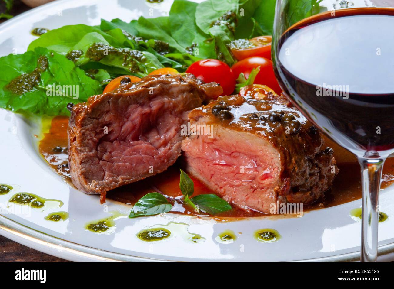 Filet mignon with sauce, salad and potato Stock Photo - Alamy