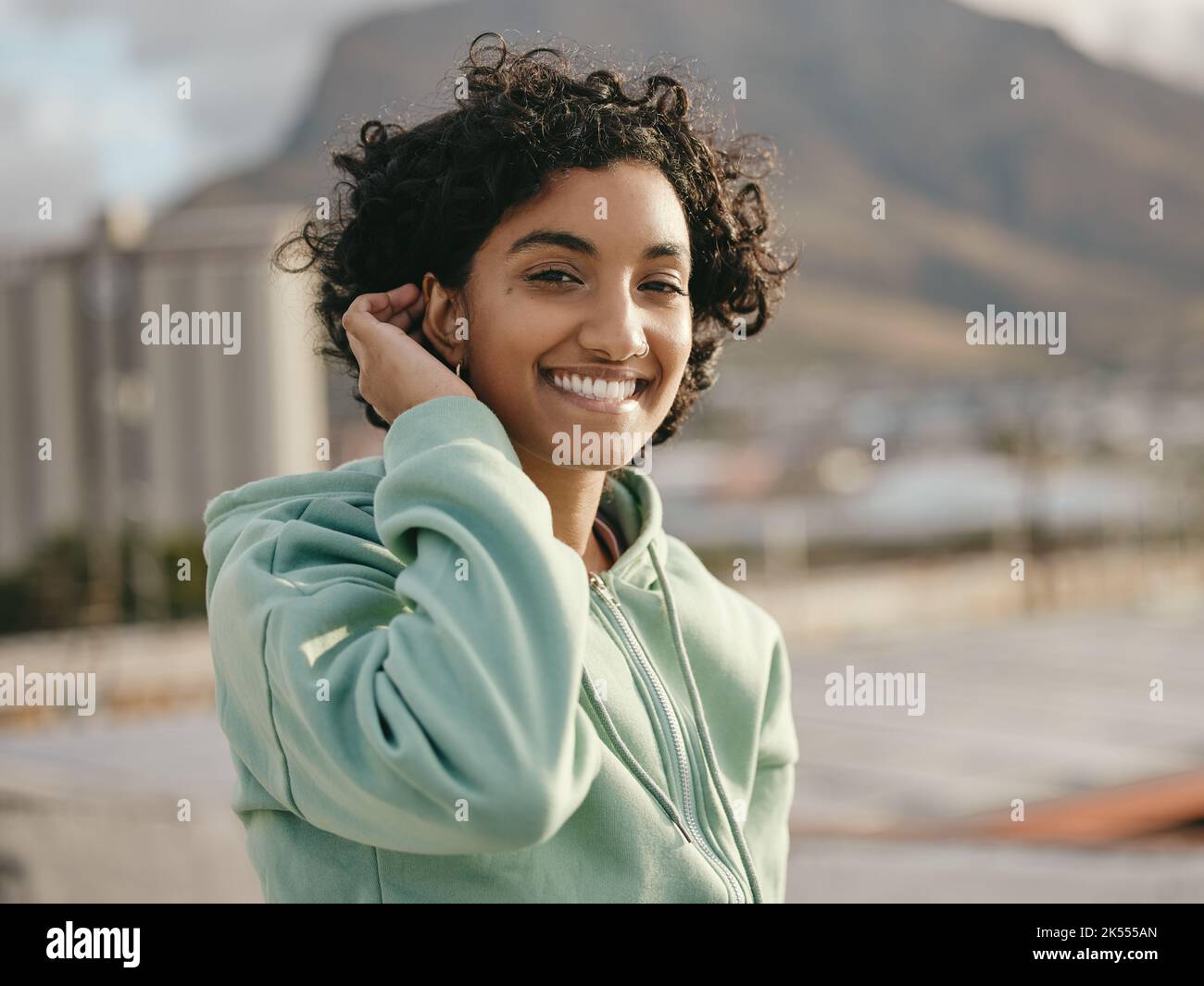 Face, smile and happy young woman feeling free and happy while smiling ...