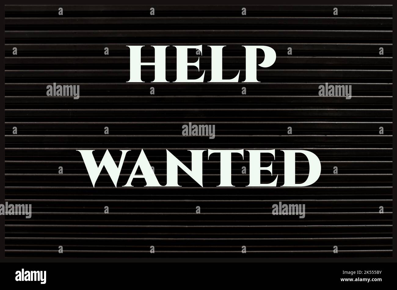 Banner sign now hiring help wanted hi-res stock photography and images ...