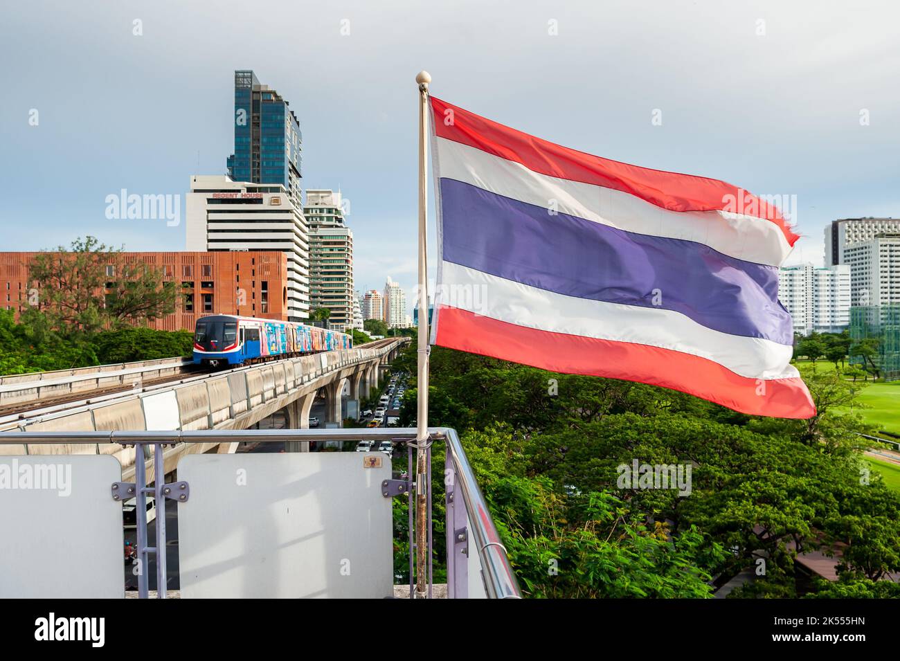 The Thailand flag flies on the platform of the BTS mass transit sky ...
