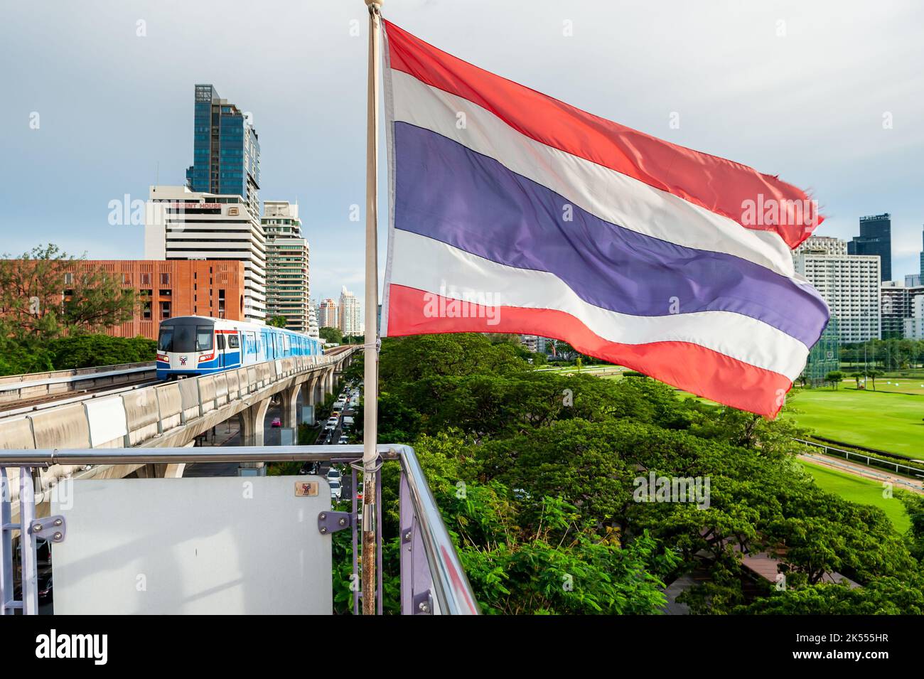 The Thailand flag flies on the platform of the BTS mass transit sky ...