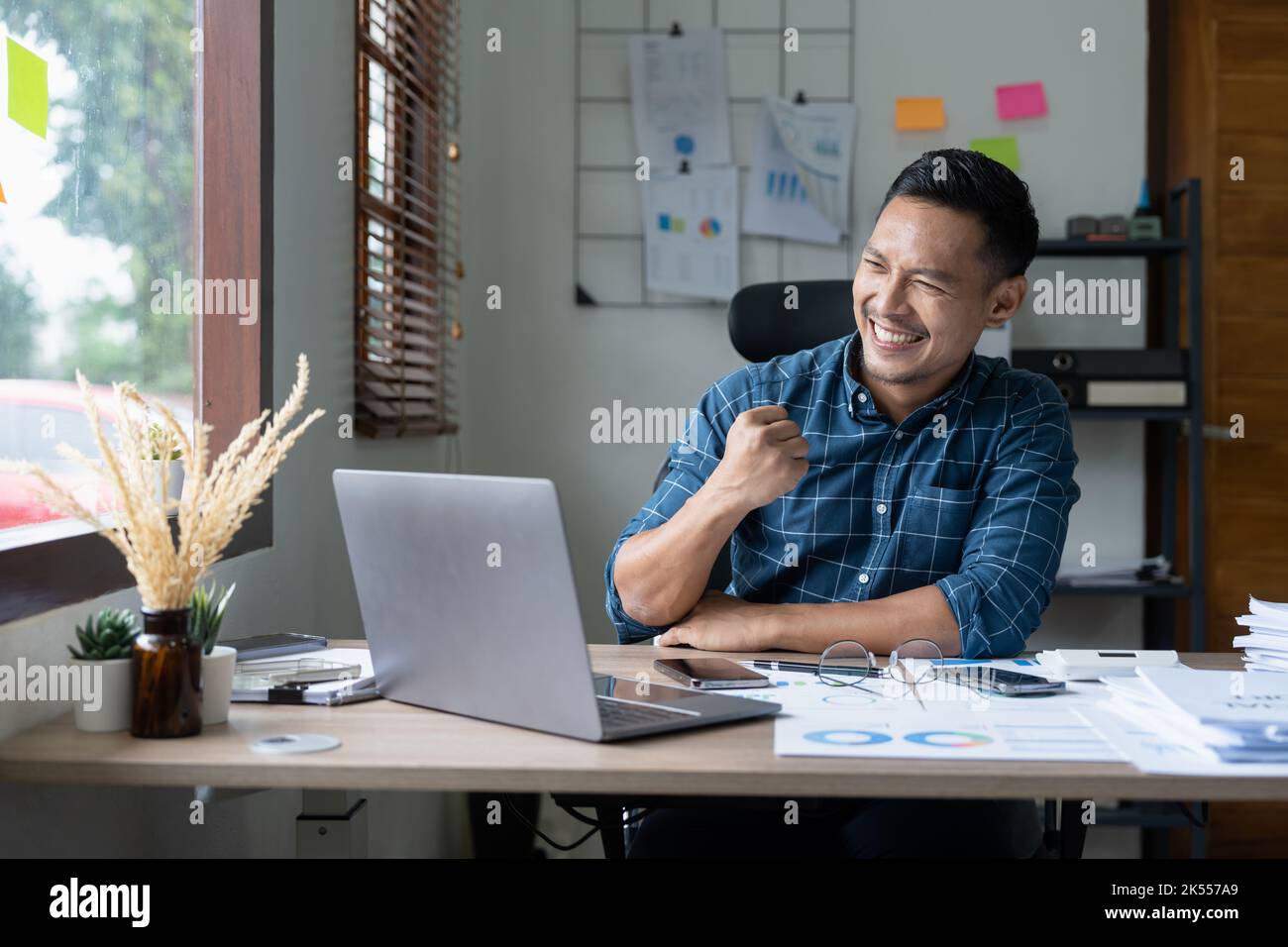 Portrait of happy business asian man celebrating success achievement ...