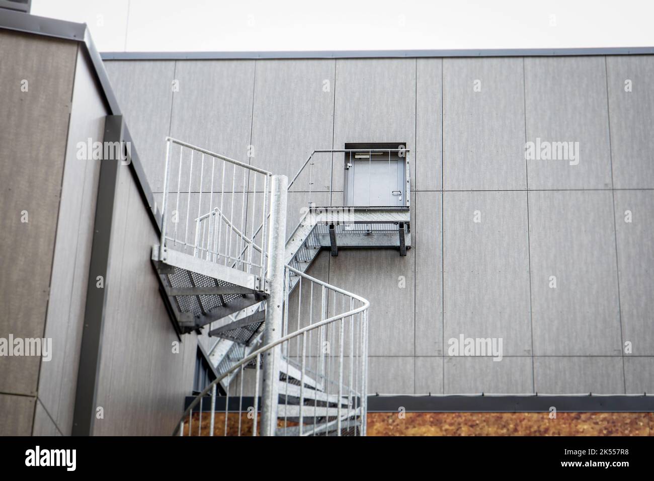 Security exit. Metal doors and stairs. Building facade and architecture ...