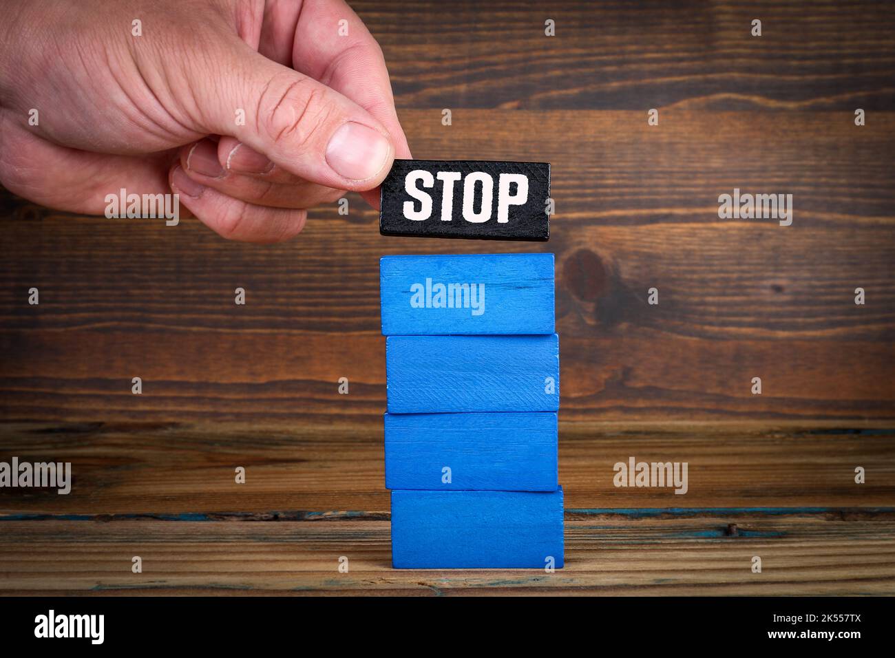 STOP. Business and development concepts. blue and black blocks on wood ...