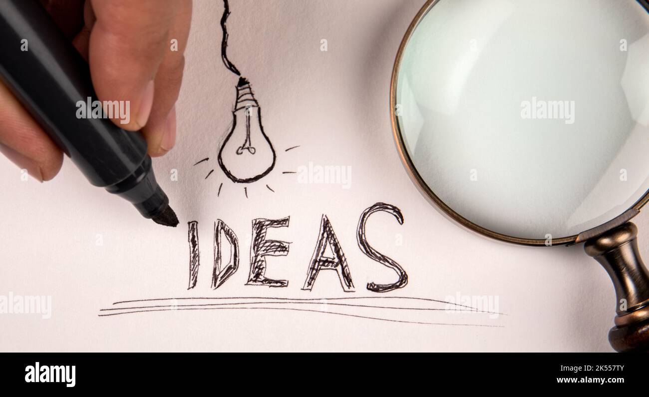 Ideas concept. Text and magnifying glass on white background Stock ...