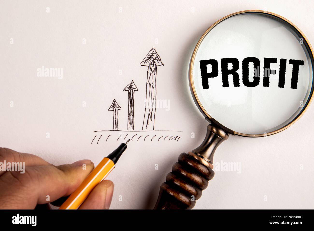 Profit. Business graph and magnifying glass on a white background Stock ...