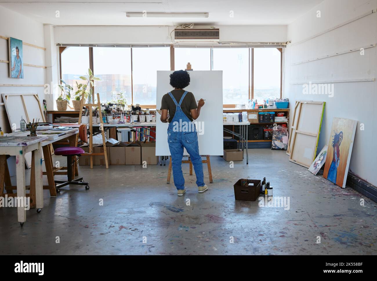 Painting, canvas and creative black woman artist in studio workshop ...
