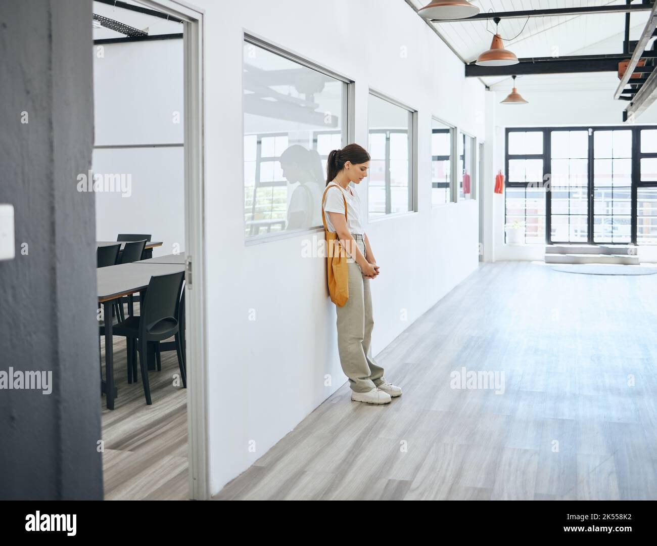 Depression, stress and woman standing in office upset, sad and ...