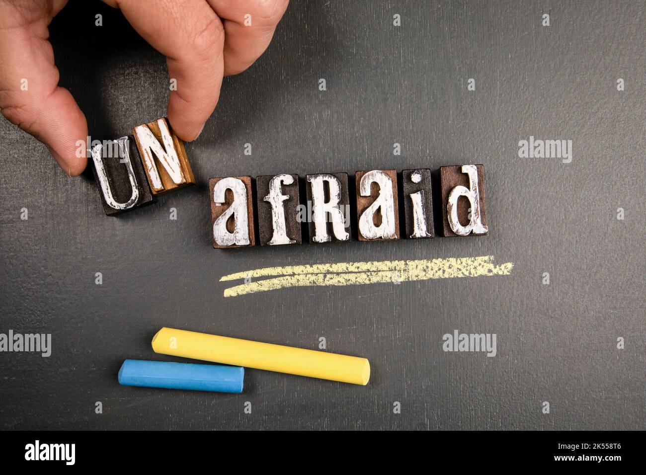 Unafraid and Afraid concept. Wooden alphabet letters and text on ...