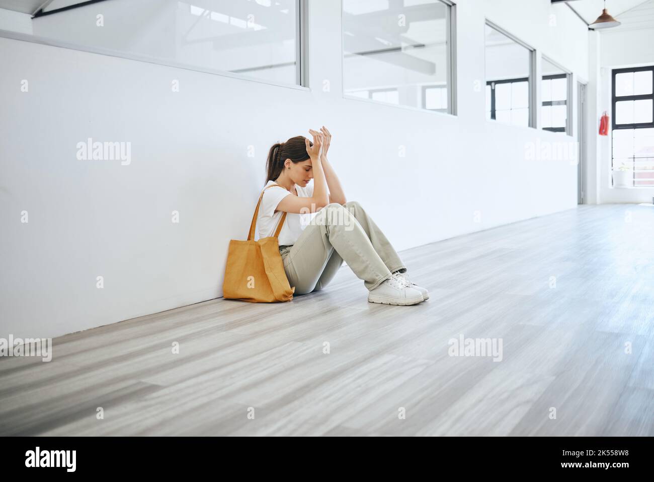 Stressed woman sitting on ground hi-res stock photography and images ...