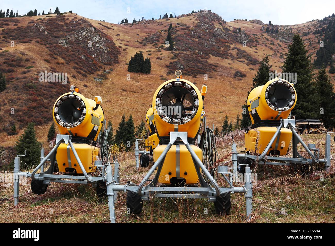 yellow snow cannons on the mountain at the ski resort Stock Photo - Alamy