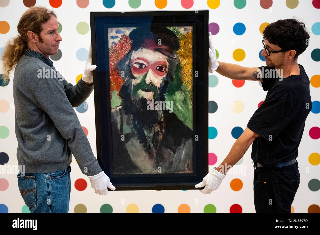 London, UK. 6 October 2022. Technicians with Marc Chagall’s “Portrait ...