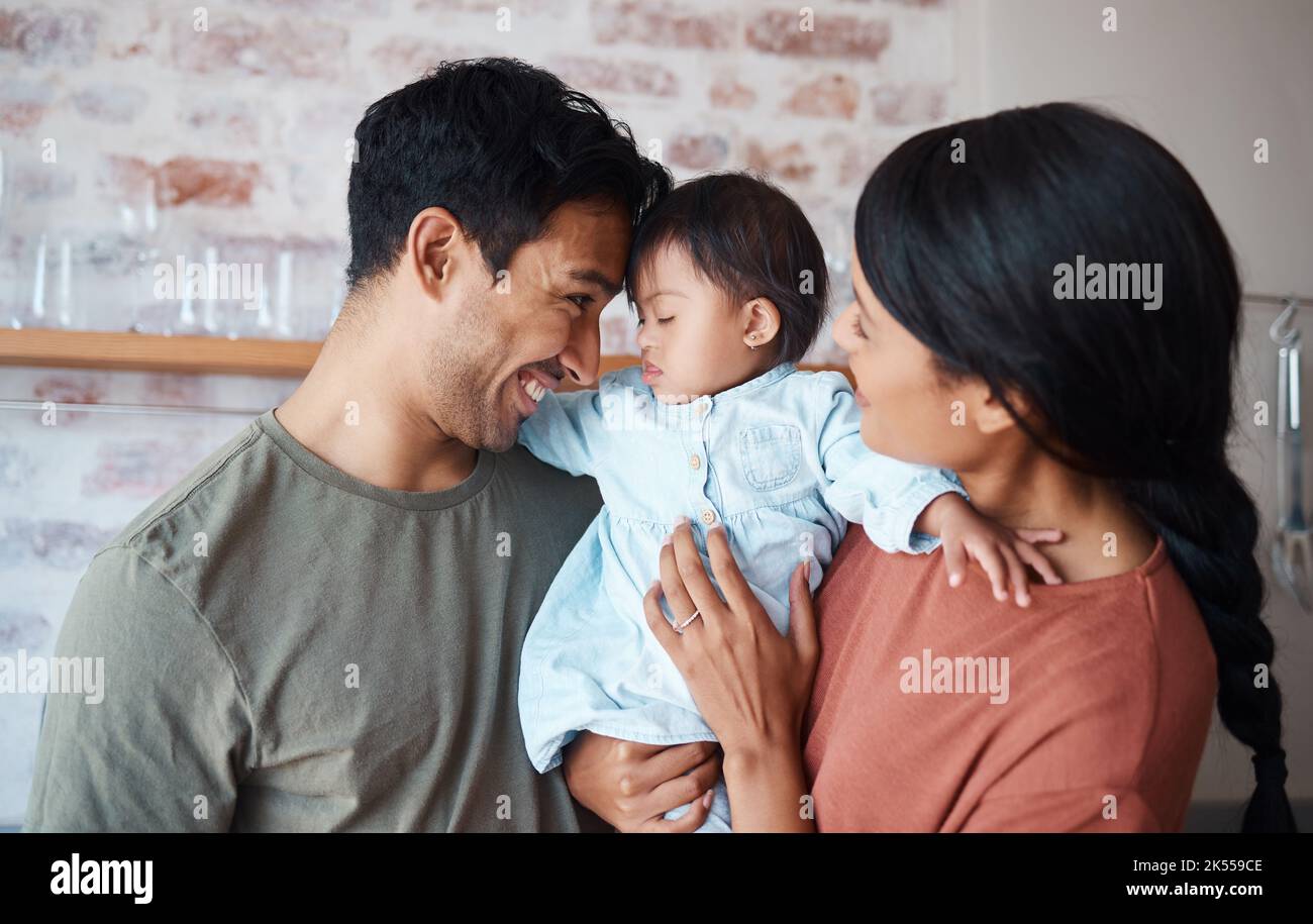 Happy family, down syndrome baby and love in home, bonding and caring ...