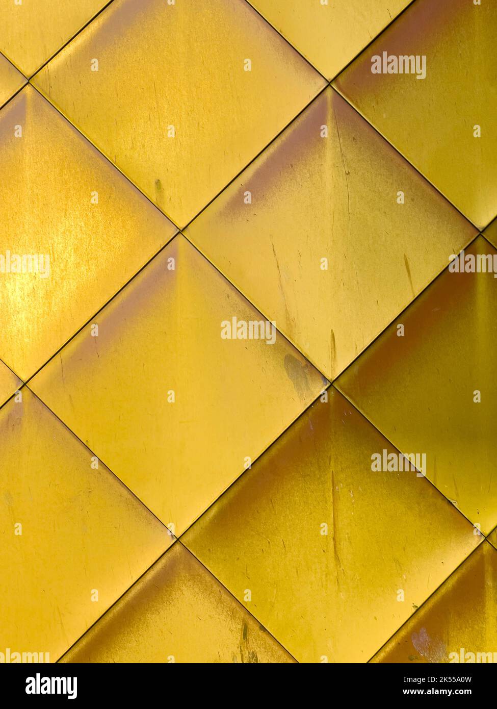 Golden yellow brass tiles wall background Stock Photo - Alamy