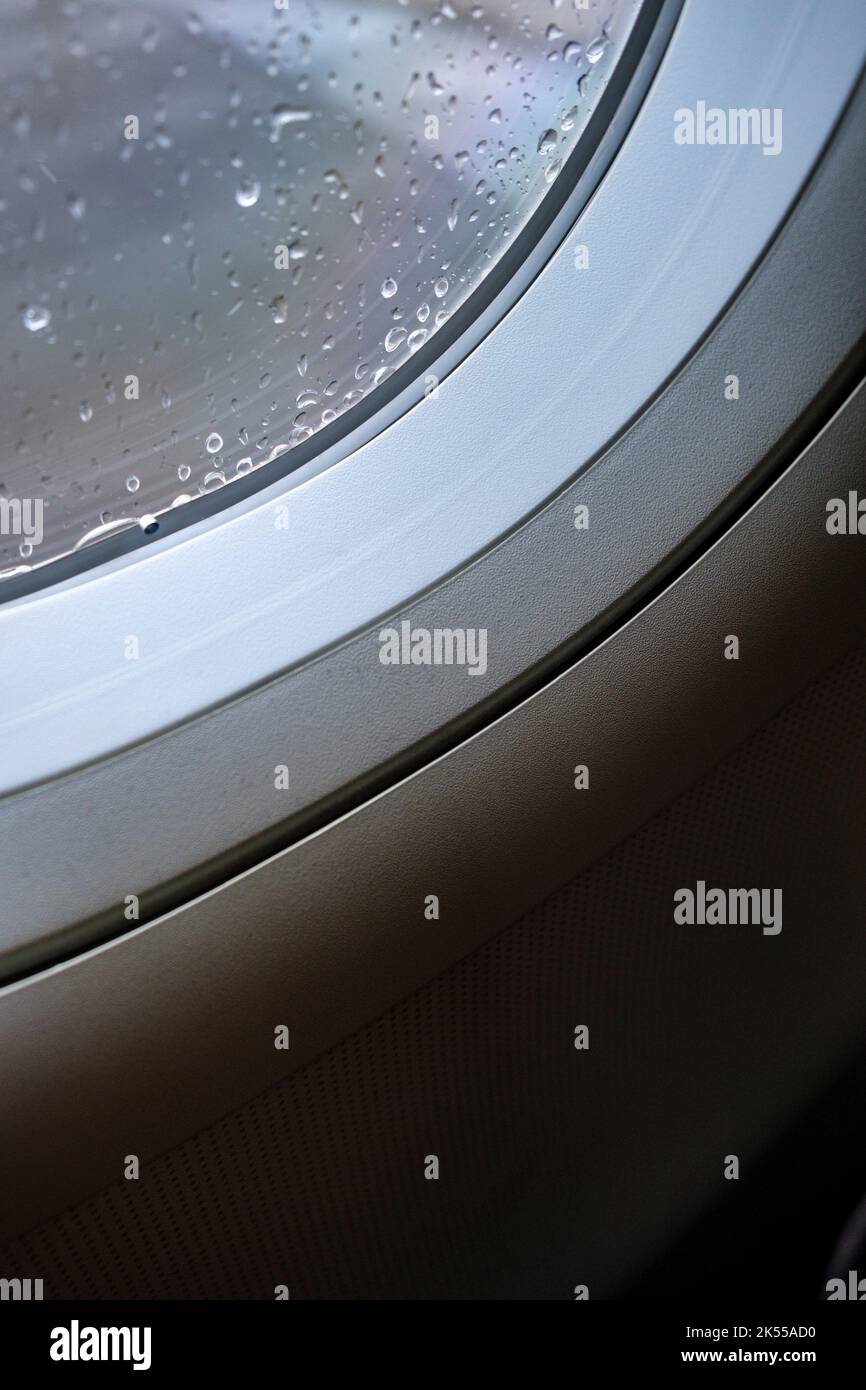 View through an aeroplanes window as it takes off from Heathrow with ...