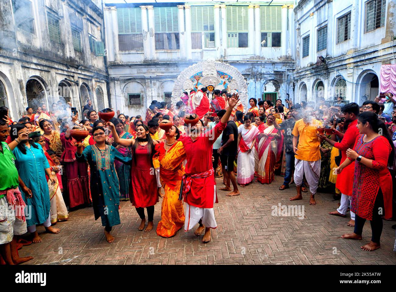 Hindu devotees seen dancing with Dhunachi (Indian incense burner) next ...