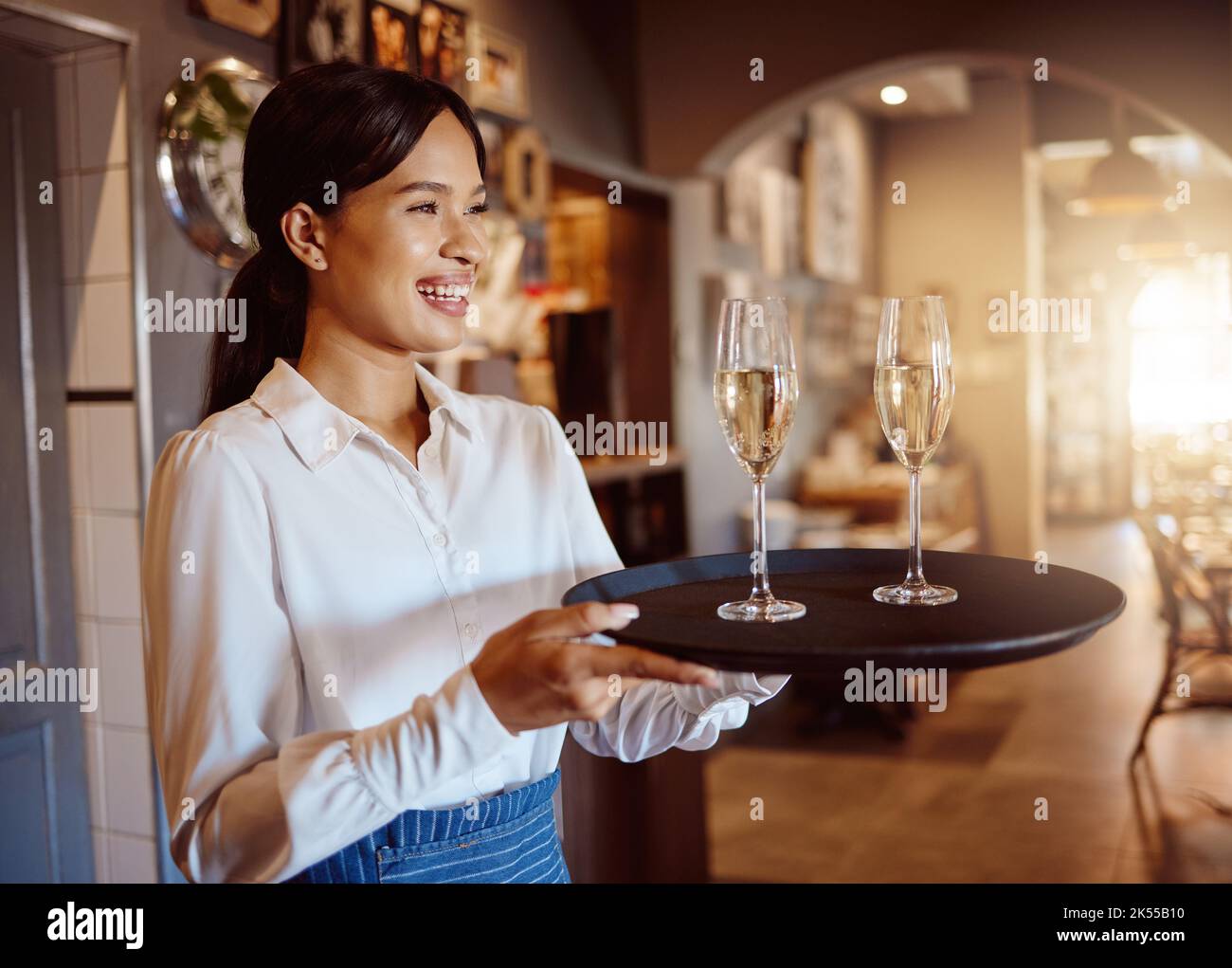 Waitress, wine glass tray and hospitality service in restaurant, cafe ...