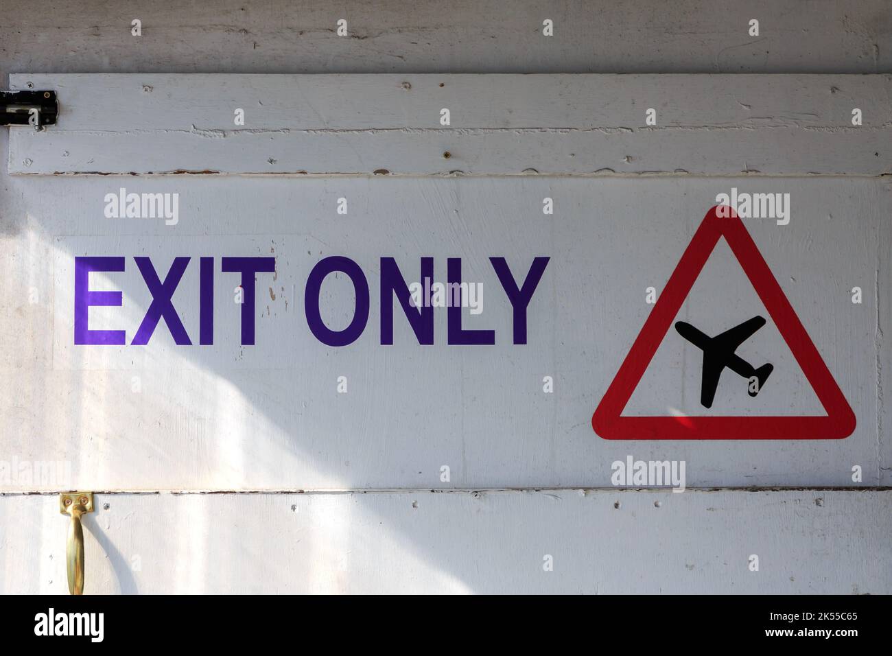 Exit only sign and red triangle warning sign of aircraft Stock Photo ...