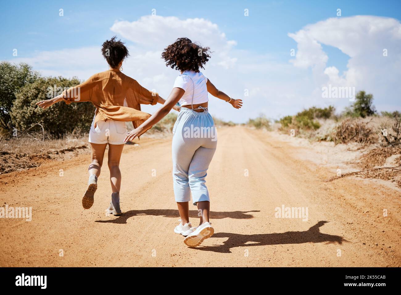Summer, countryside and friends running in road in nature, celebrating ...