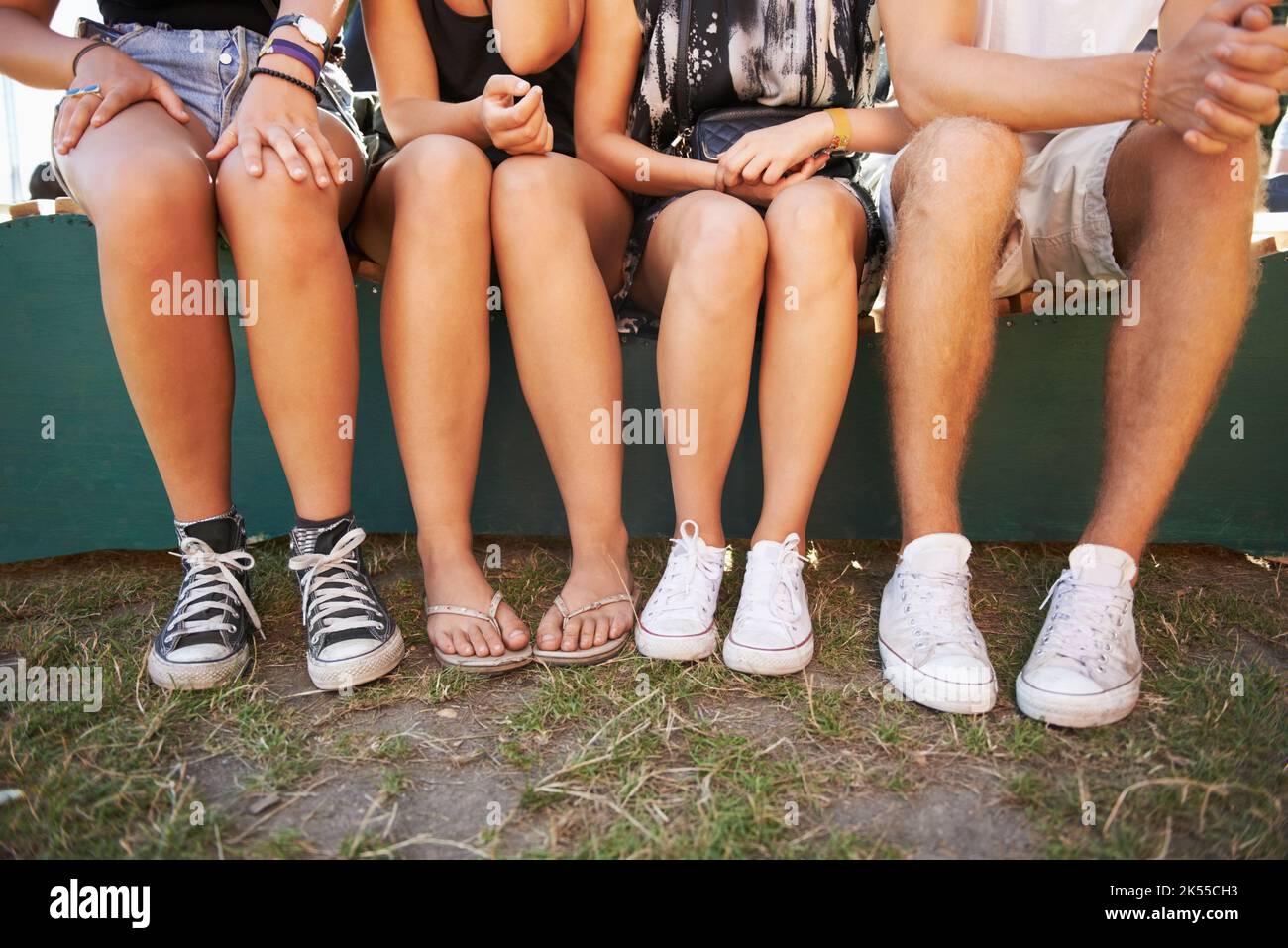 Festival footwear. Cropped image of a group of young peoples feet at a ...