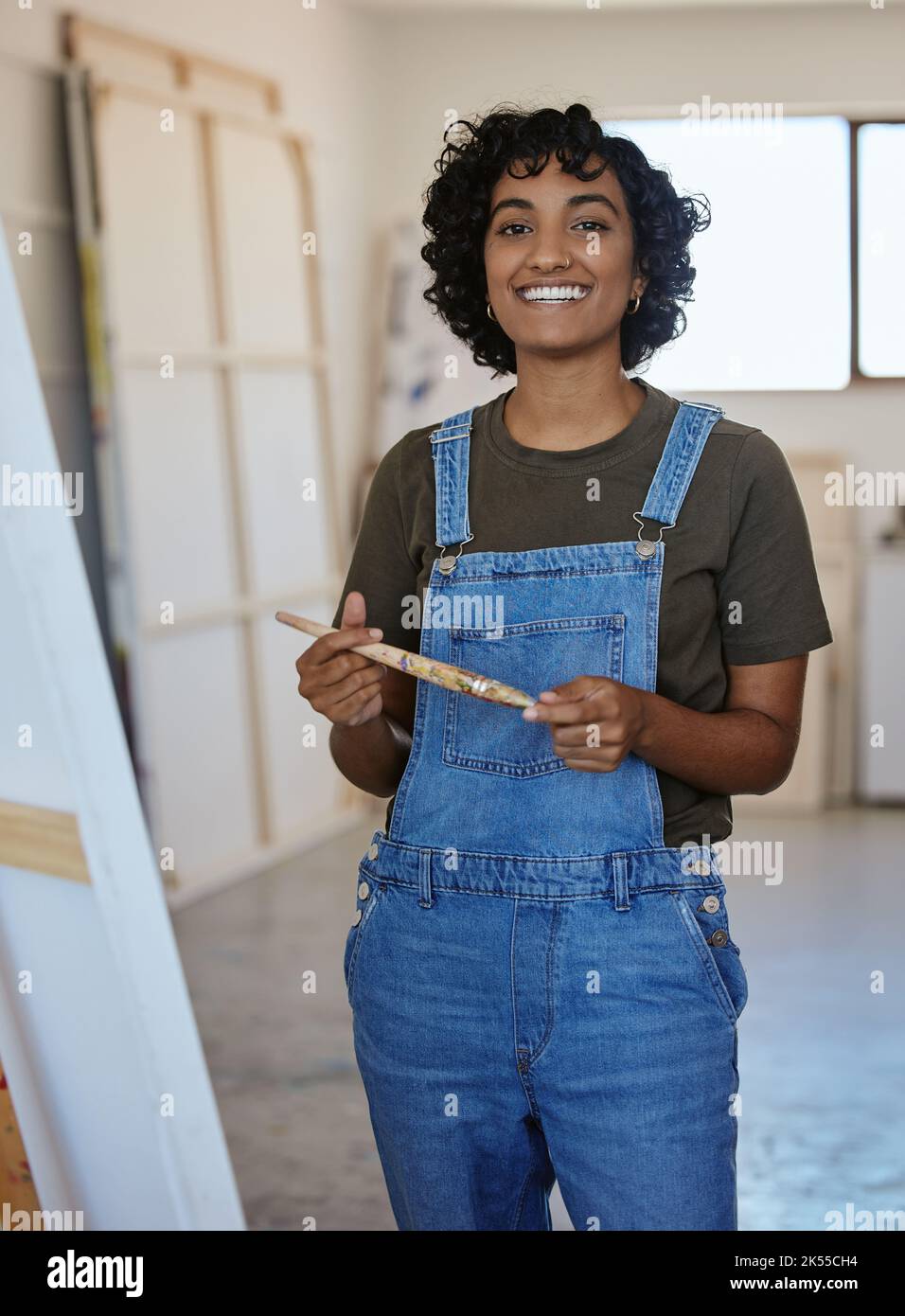 Paint, creative and art with a woman artist painting on a canvas in her ...