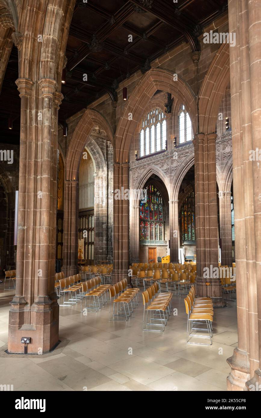 Seating in the nave of Manchester Cathedral, a gothic building in the ...