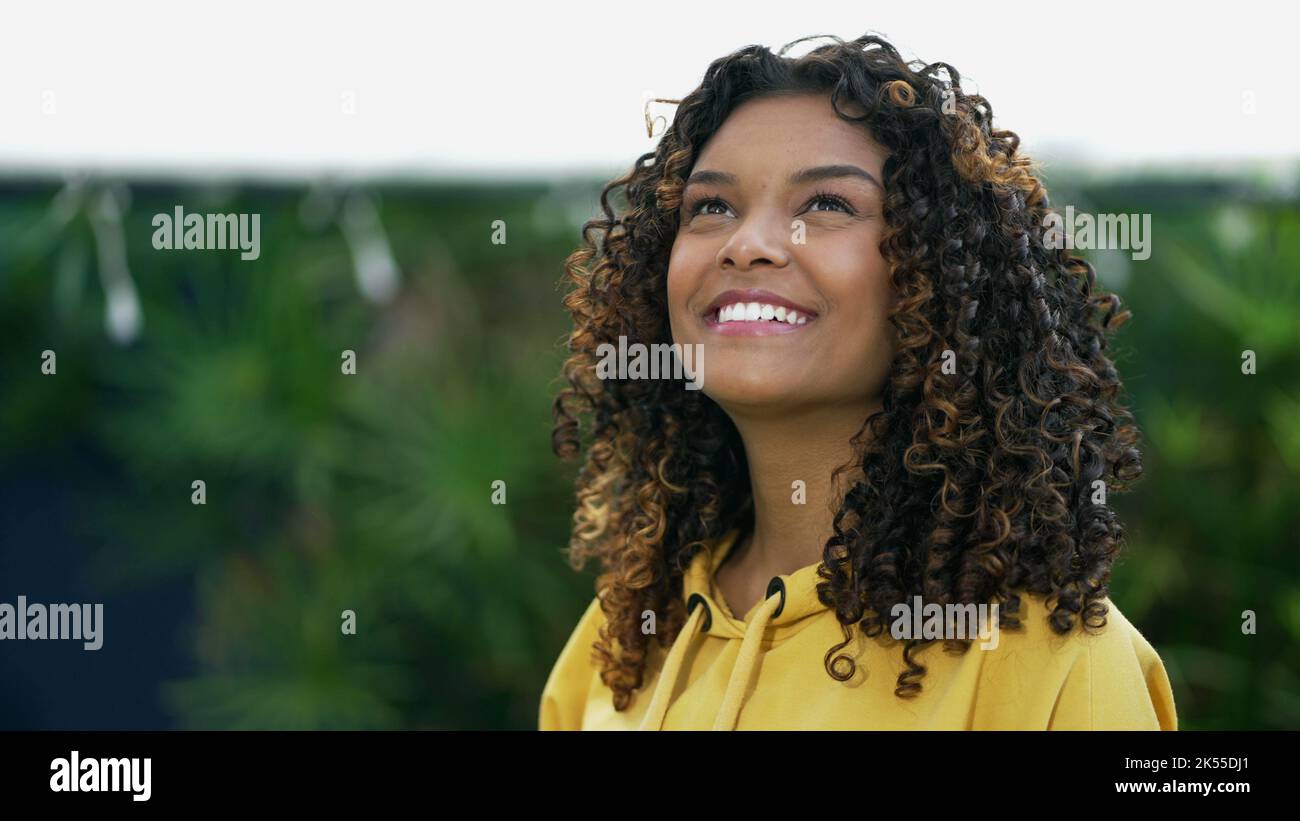 Happy African American woman closeup face looking up at sky smiling ...