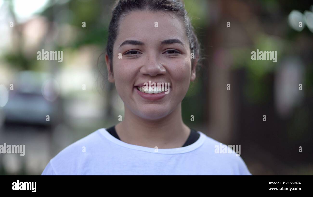 One Brazilian hispanic young woman walking forward toward camera. South ...