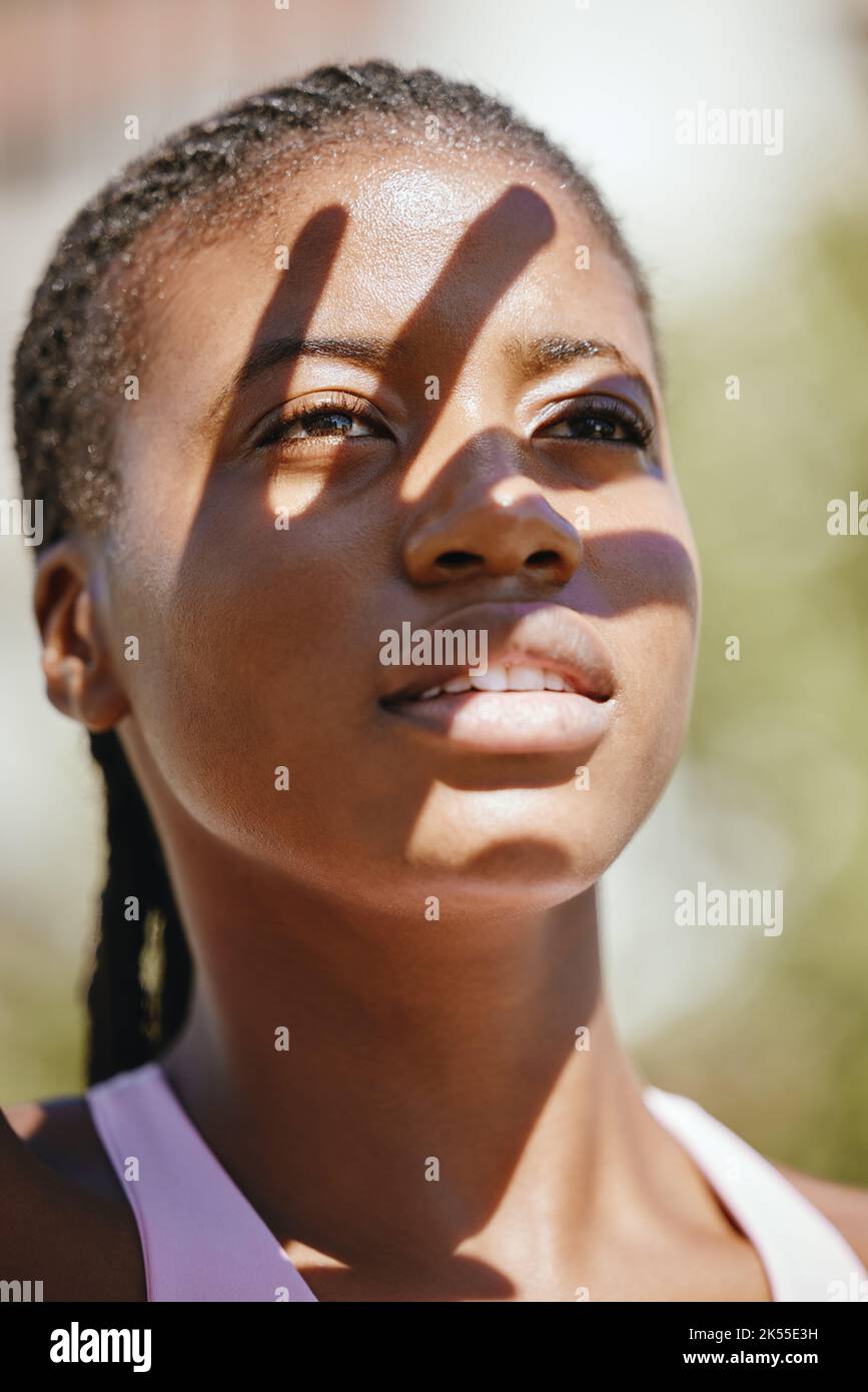 Shadow, fitness and hand of black woman for safety from sun during ...
