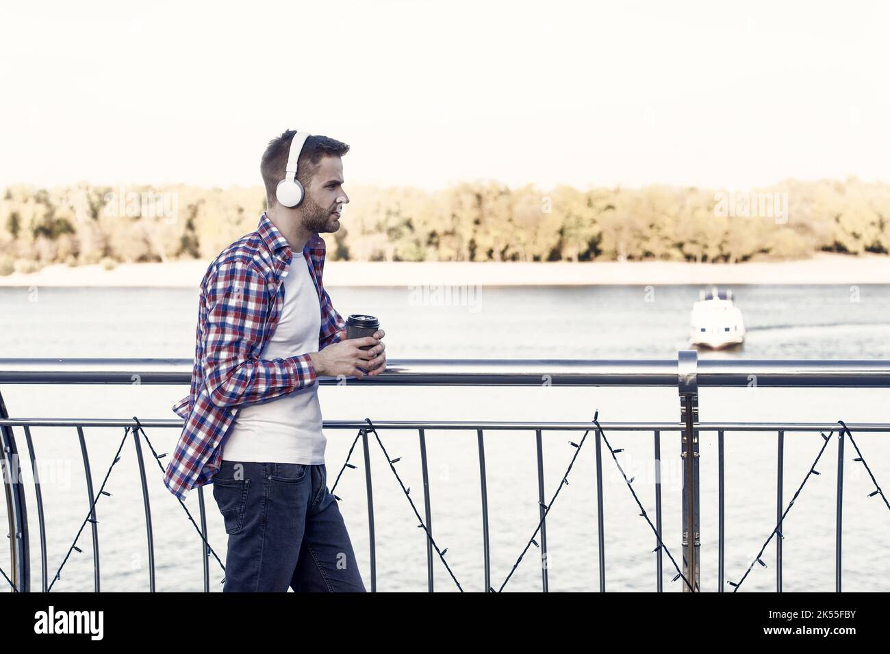 good morning drink. unshaven guy with coffee cup outdoor. male casual ...