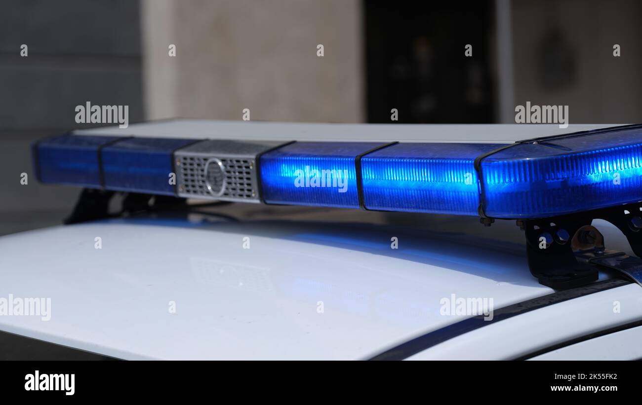 Blue lights on roof of police car in city Stock Photo - Alamy