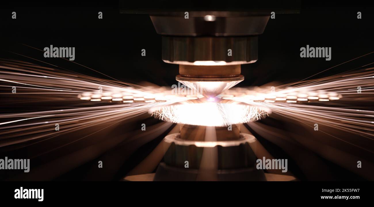 Laser cutting of metal sheet in production closeup Stock Photo - Alamy
