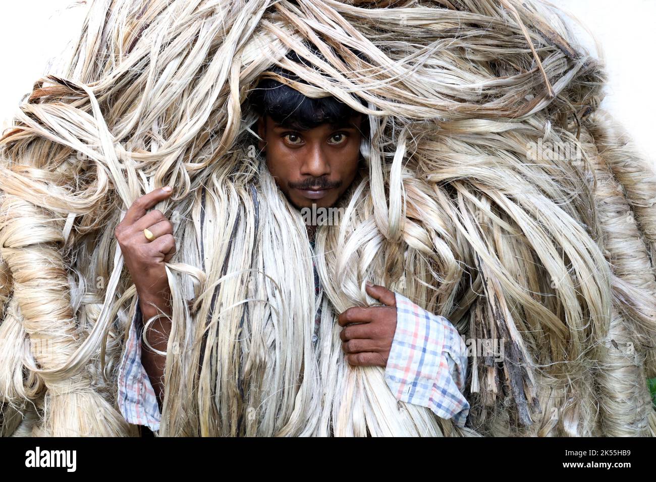 October 6, 2022, manikgonj, Manikgonj, Bangladesh: A man is carrying a ...