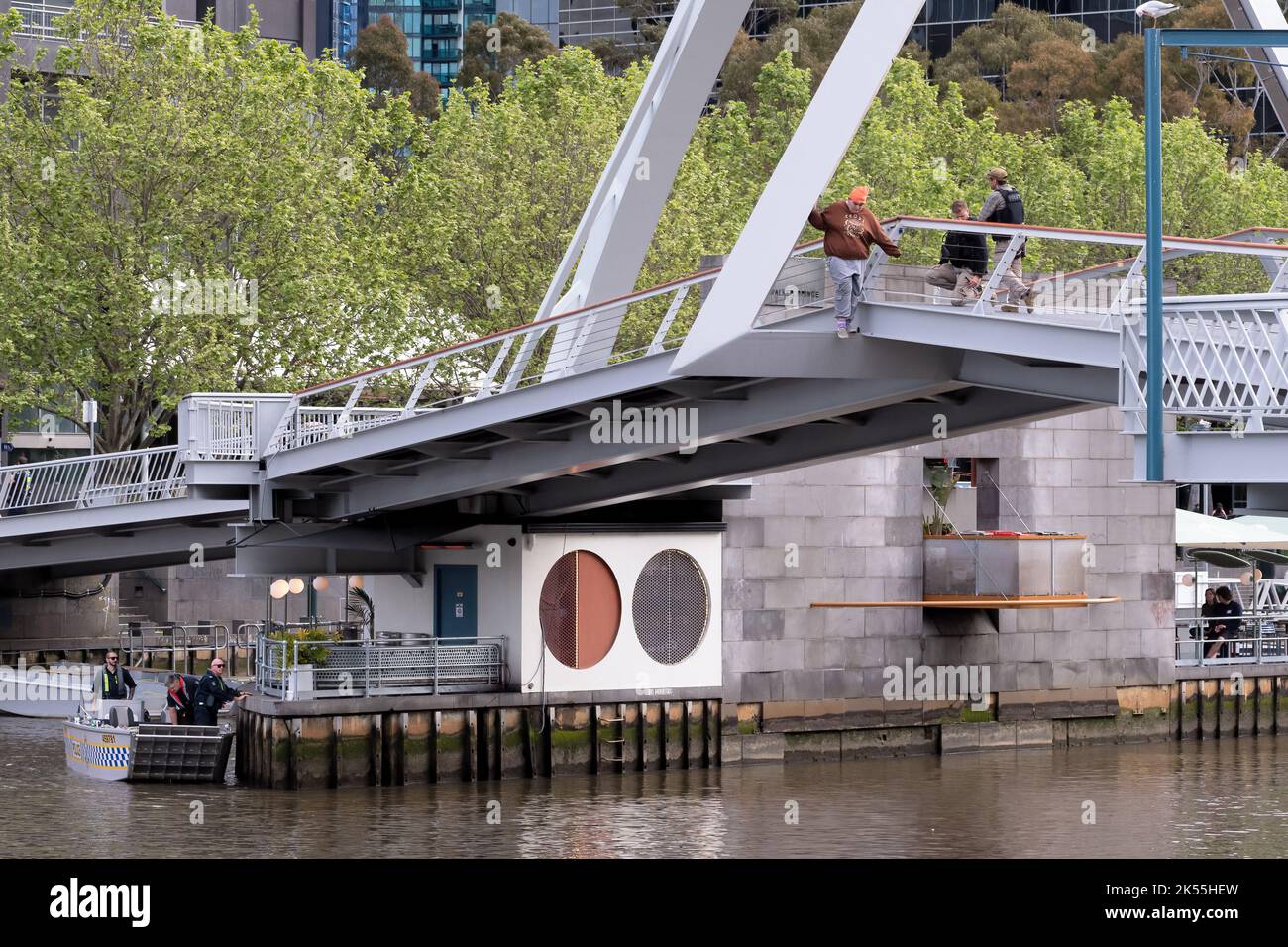 Melbourne, Australia, 6 October, 2022. A police negotiator speaks to a ...