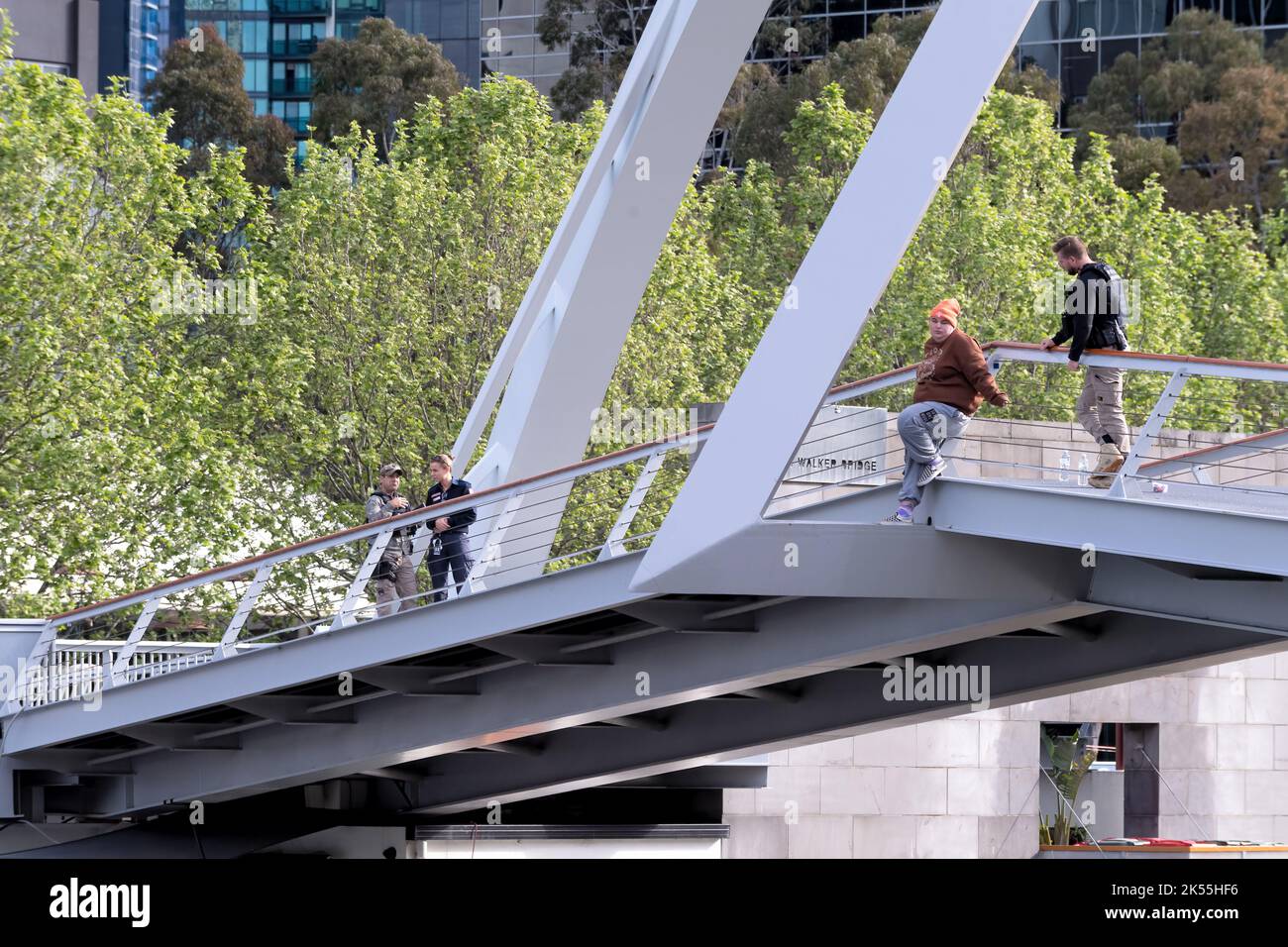 Melbourne, Australia, 6 October, 2022. A police negotiator speaks to a ...