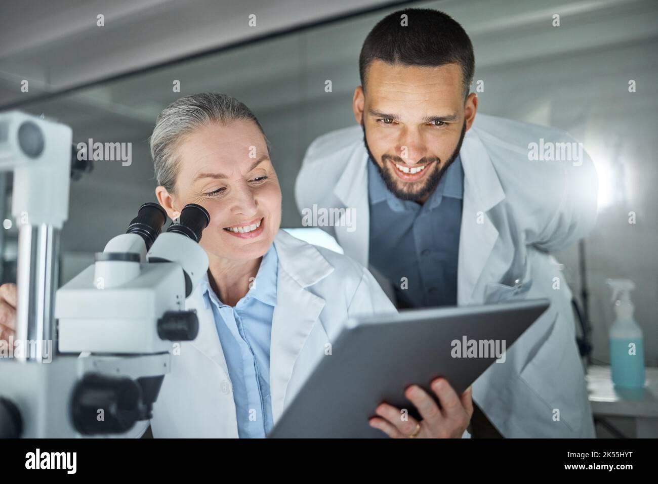 Laboratory collaboration, microscope or tablet in science data analysis ...