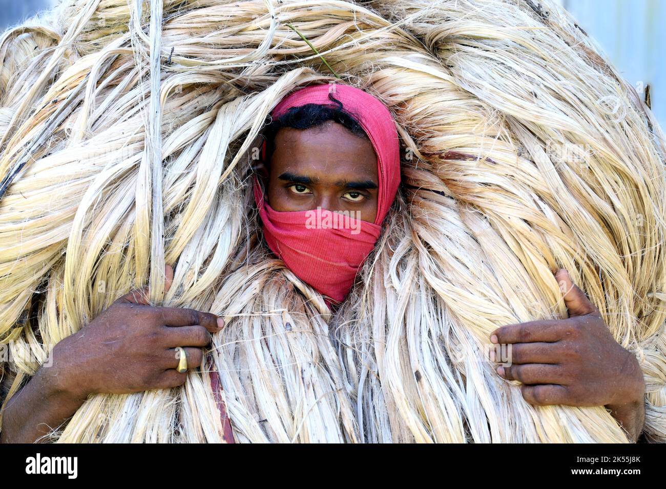 October 6, 2022, manikgonj, Manikgonj, Bangladesh: A man is carrying a ...
