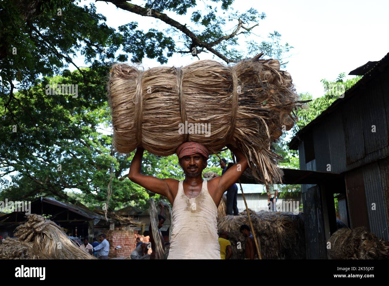 October 6, 2022, manikgonj, Manikgonj, Bangladesh: A man is carrying a ...