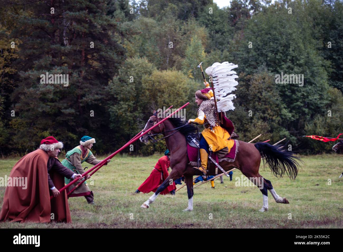 Living history: reenactment of a 17th century battle, men with spears ...