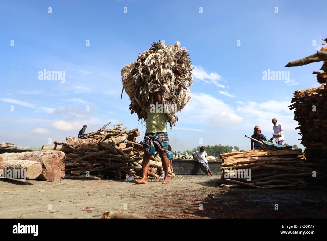 October 6, 2022, manikgonj, Manikgonj, Bangladesh: A man is carrying a ...