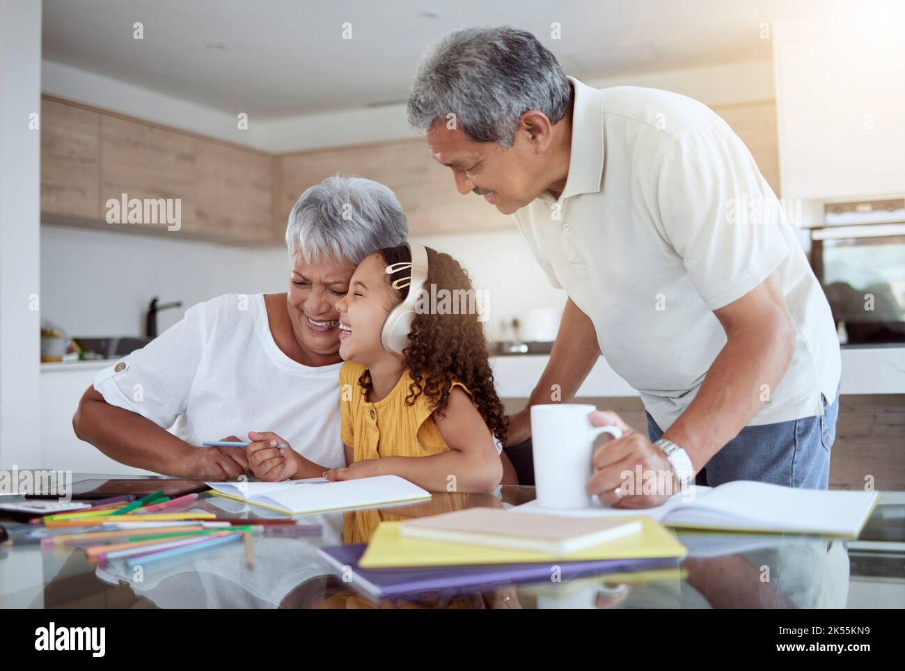 Family, learning and education with a girl and grandparents laughing ...