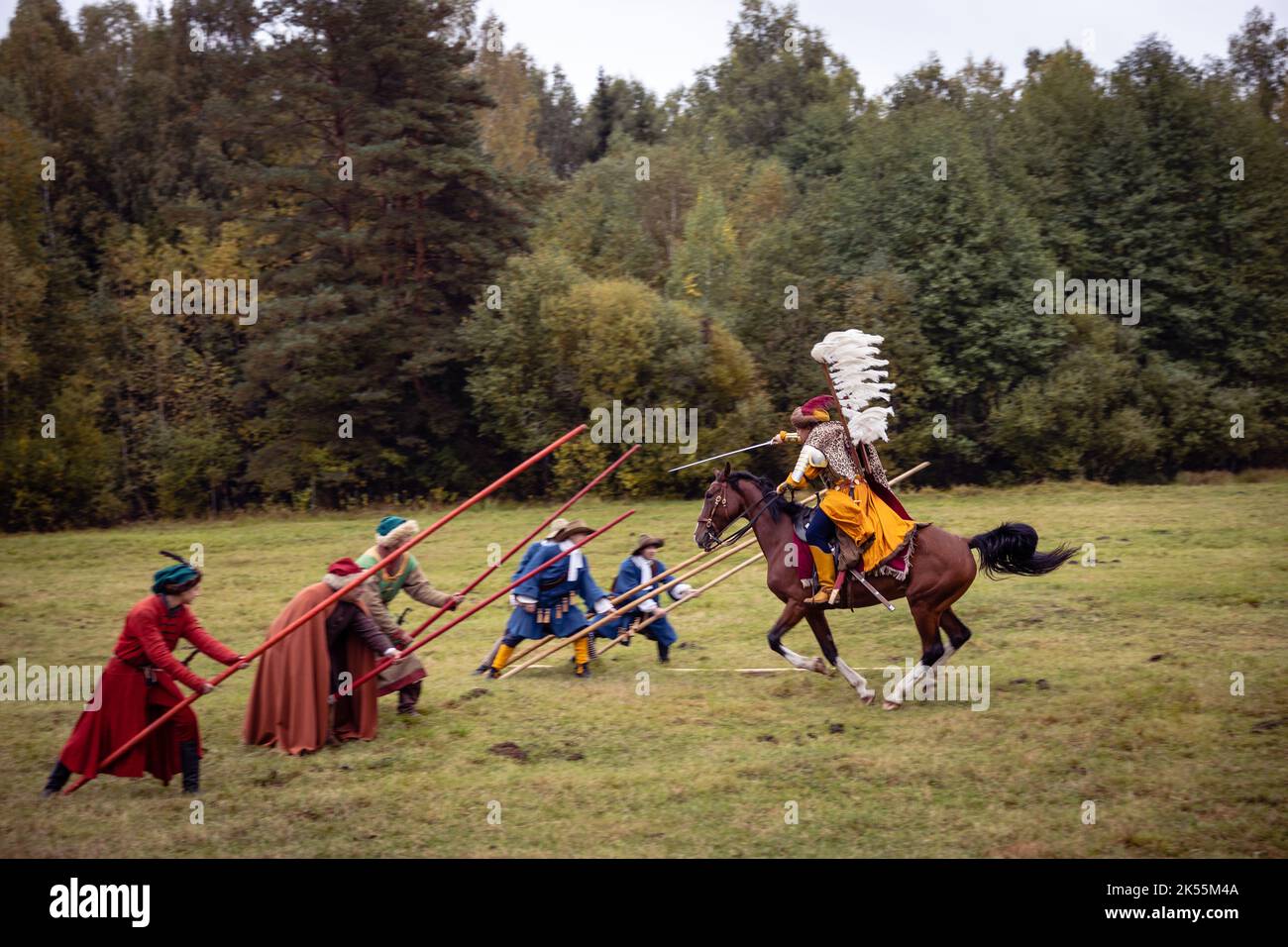 Living history: reenactment of a 17th century battle, men with spears ...