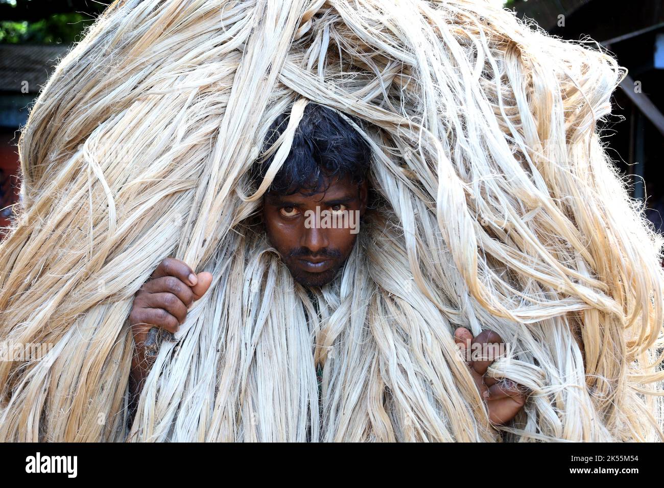 October 6, 2022, manikgonj, Manikgonj, Bangladesh: A man is carrying a ...