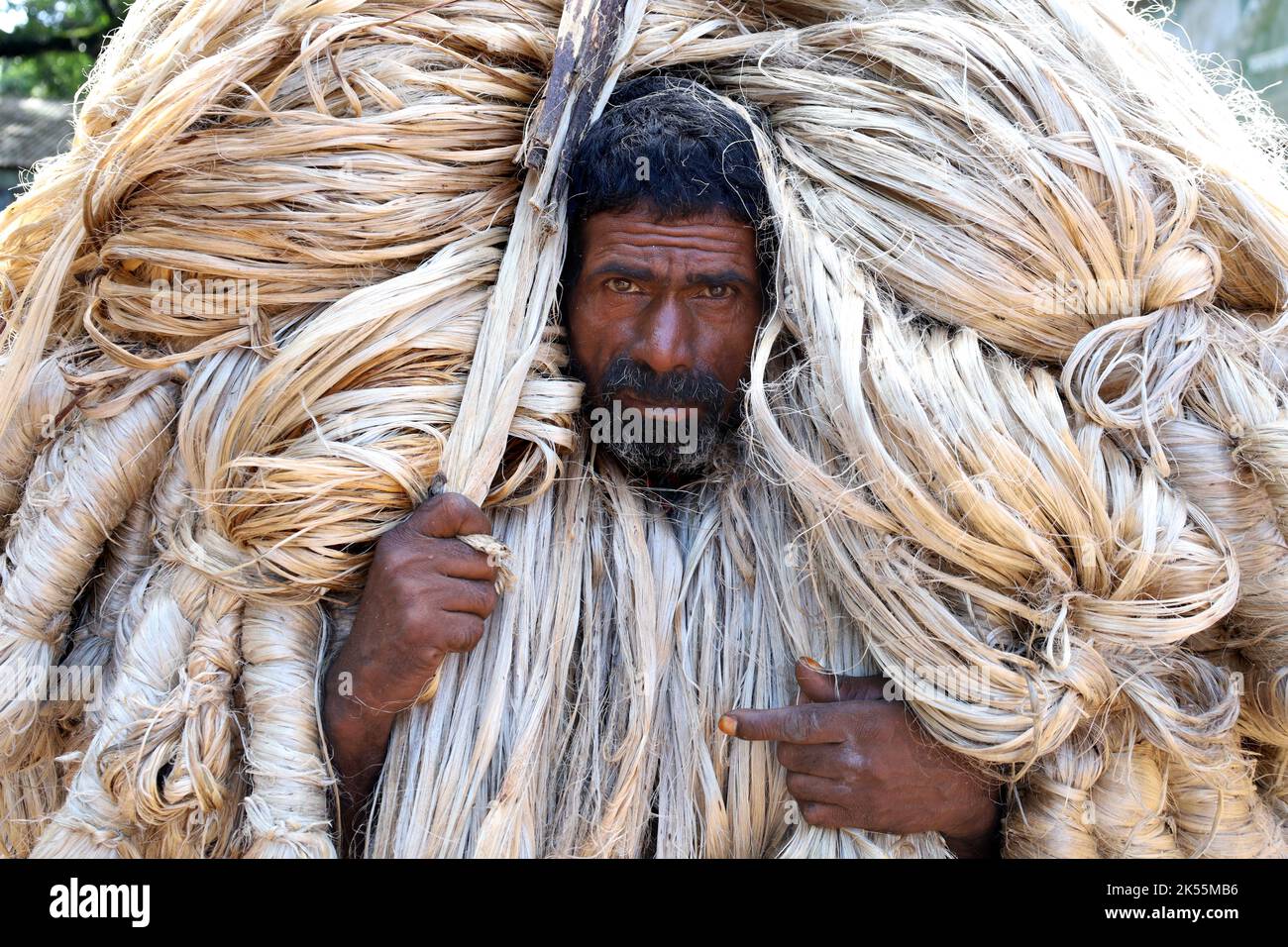 October 6, 2022, manikgonj, Manikgonj, Bangladesh: A man is carrying a ...