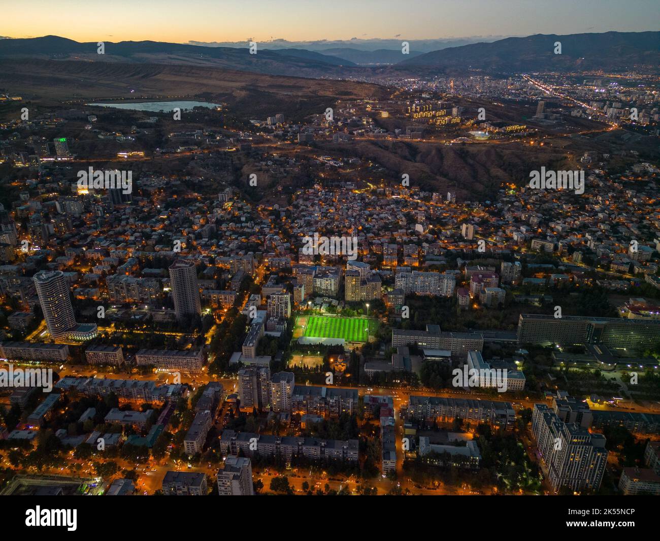 An aerial view of the beautiful illuminated Tbilisi city at soft ...