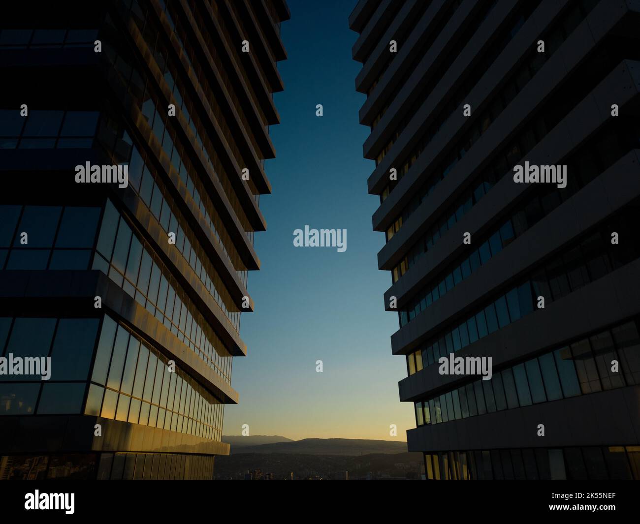 A symmetric aerial view of modern buildings at a soft sunrise Stock ...