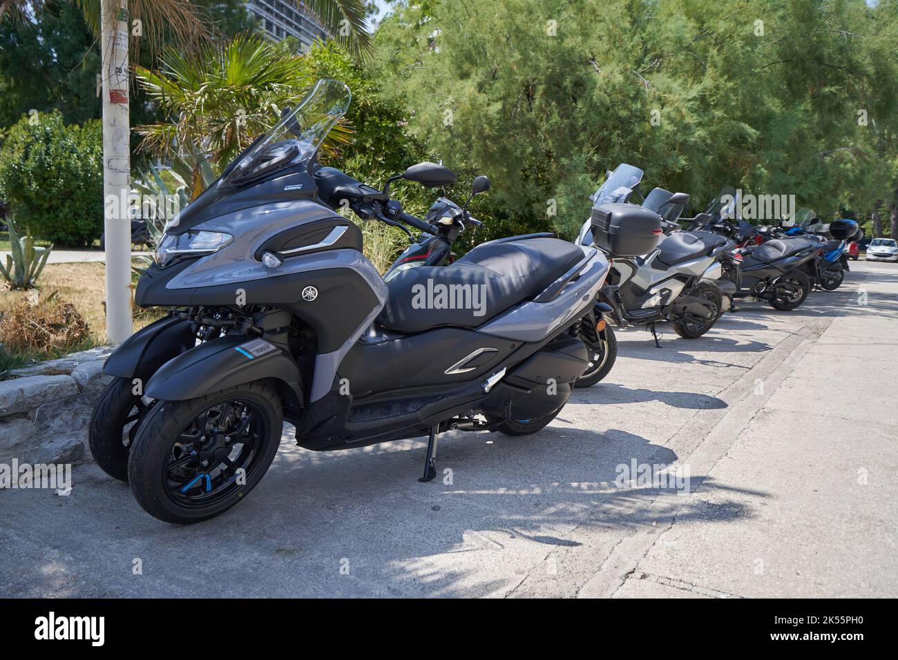 Parked motor scooter of Yamaha Tricity with three wheels Stock Photo ...