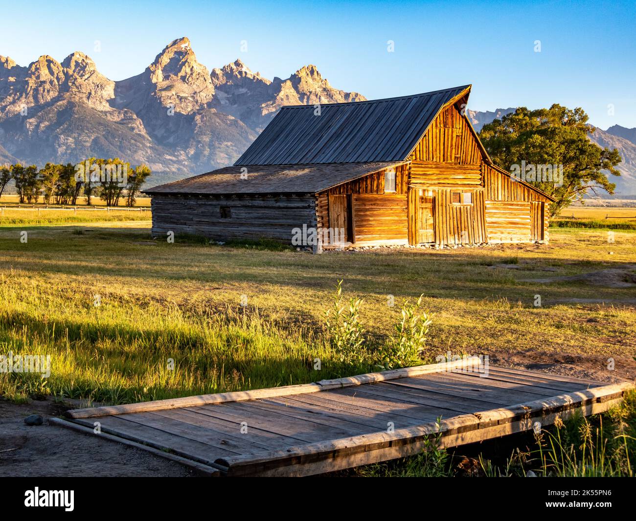 A wooden house in a field in Mormon Row, Utah and Yellowstone National ...