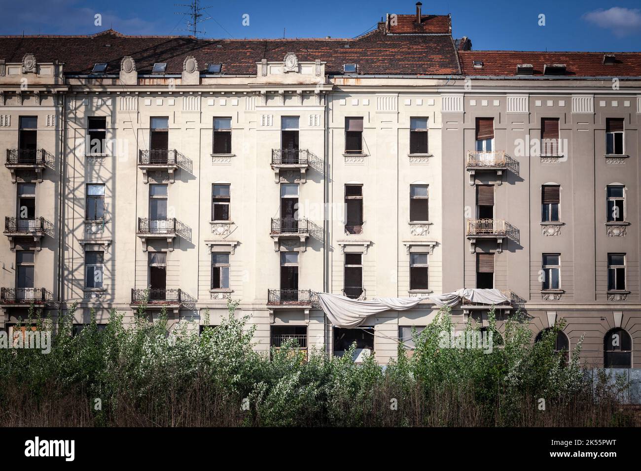 Picture of the external facade of an abandoned and damaged hotel in ...